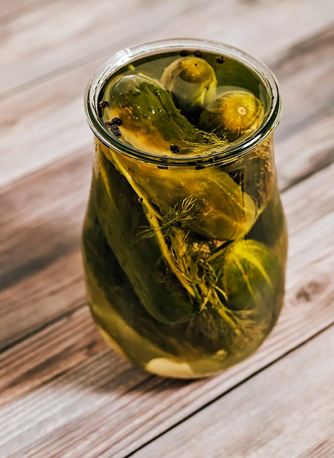 House-made pickles swimming in brine, waiting to add their tangy crunch to your sandwich experience. Pucker up, buttercup.