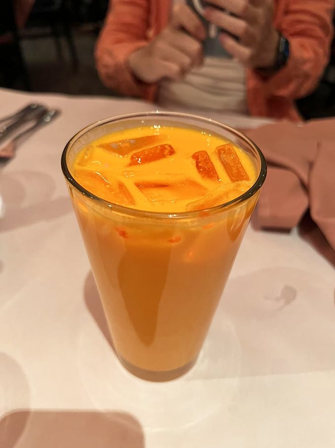 The mango lassi arrives like a tropical vacation in a glass, with chunks of fruit swimming in yogurty bliss.