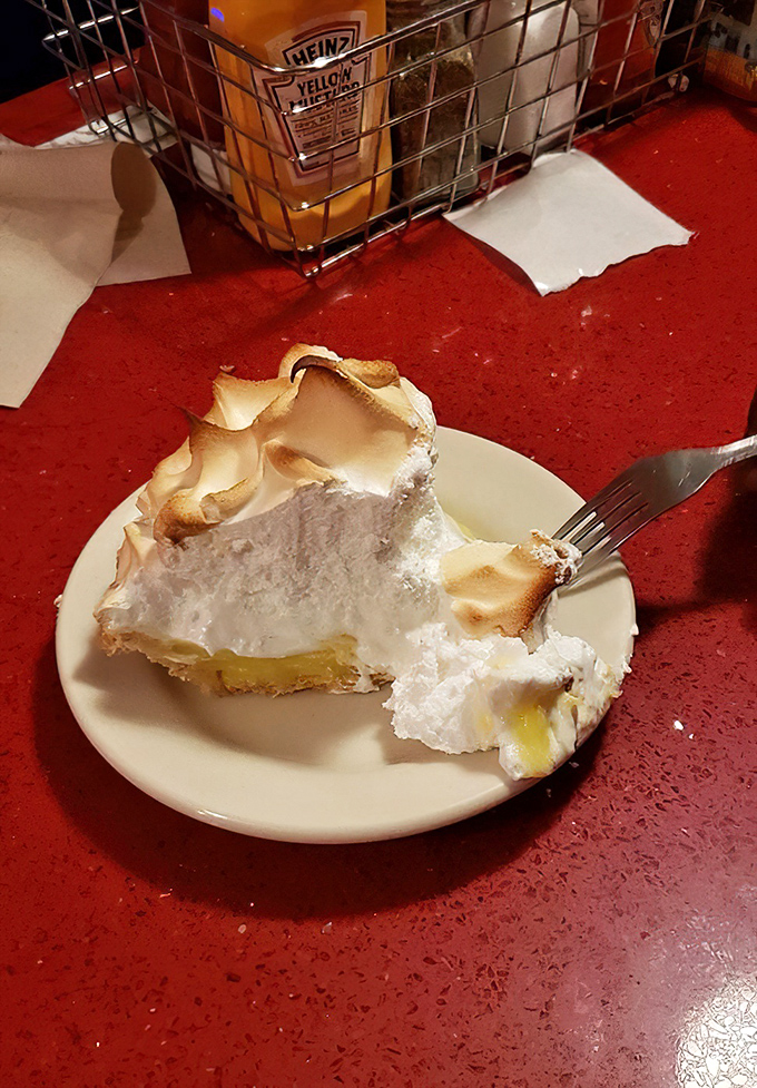 Lemon meringue pie with peaks so high they need their own zip code. That toasted marshmallow crown is what dreams are made of.