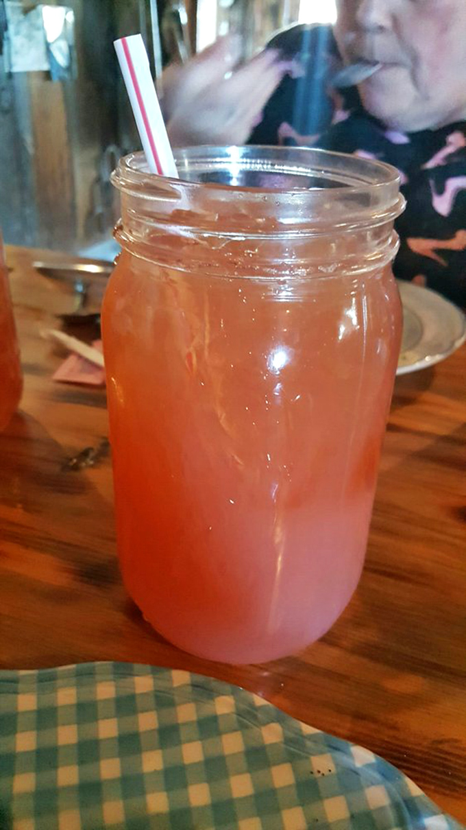 Pink lemonade in a Mason jar&mdash;simple country refreshment that perfectly cuts through the richness of what's about to arrive at your table.