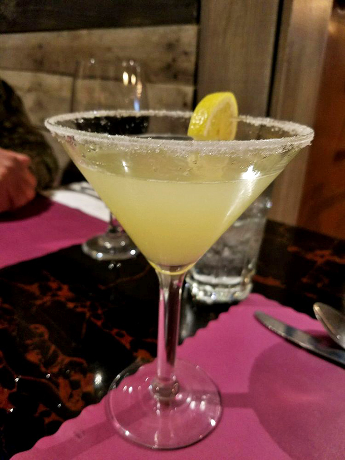 A lemondrop martini with its sugar-rimmed edge – because sometimes your palate needs a bright, citrusy intermission between bites of rich steak.