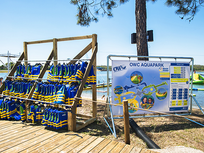 Life vests hang ready for action—a colorful army of buoyancy standing between you and an unplanned swimming lesson.