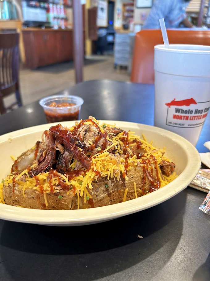 The loaded potato: a humble spud transformed into a throne for smoky meat and melted cheese&mdash;comfort food achieving its highest purpose.