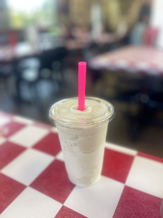 The classic diner setup invites you to linger, where every table feels like the best seat in the house.