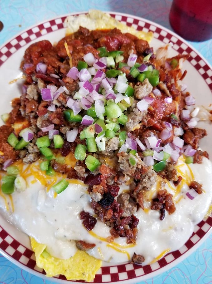 Matt's Dilemma isn't deciding whether to eat it, but how to tackle this mountain of toppings, cheese, and saucy goodness without wearing half of it home.