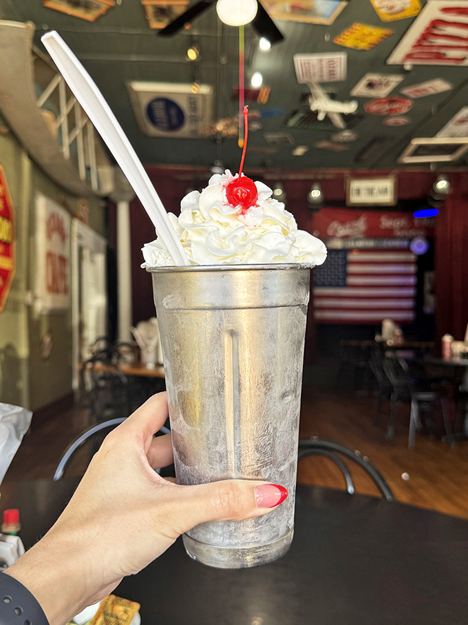 This isn't just a milkshake&mdash;it's a frosty silver chalice of happiness topped with a cloud of whipped cream and a cherry sentinel.