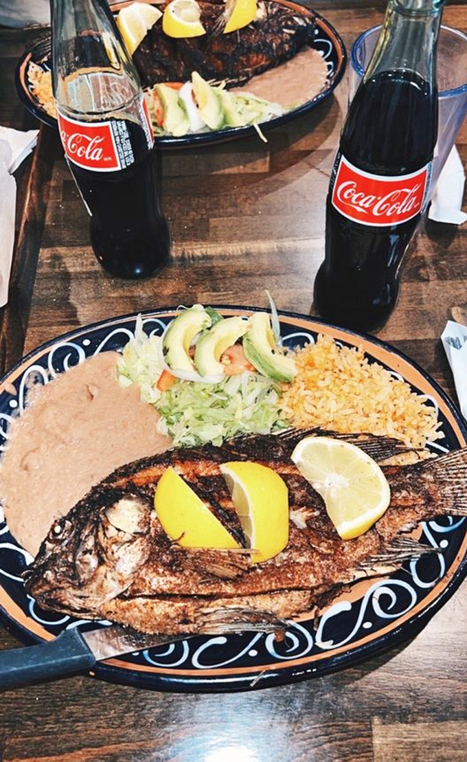A whole fish, expertly fried and presented with the confidence of coastal Mexican cuisine. The lemon wedges aren't garnish &ndash; they're essential supporting actors in this culinary drama.