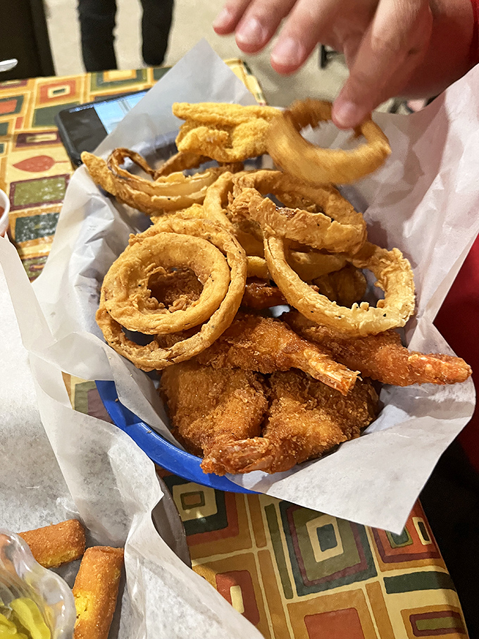 Onion rings and fried shrimp that could make a vegetarian question their life choices. Crispy, golden circles of joy that deserve their own fan club.