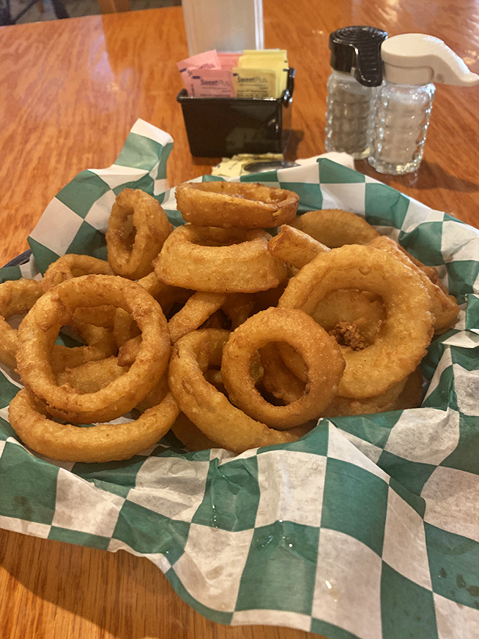 Onion rings that crunch loud enough to turn heads three tables away. Worth every napkin you'll need afterward.