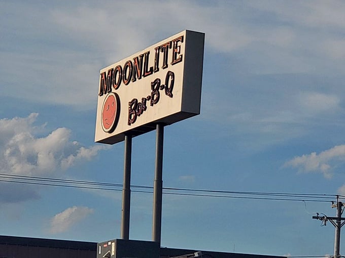That iconic sign has guided hungry travelers for generations, like a barbecue lighthouse beckoning you to safe, delicious harbor.