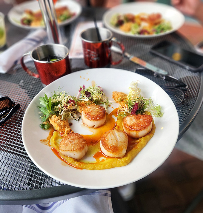 These seared scallops aren't just cooked&mdash;they're caramelized to perfection and plated like edible art on a canvas of golden puree.