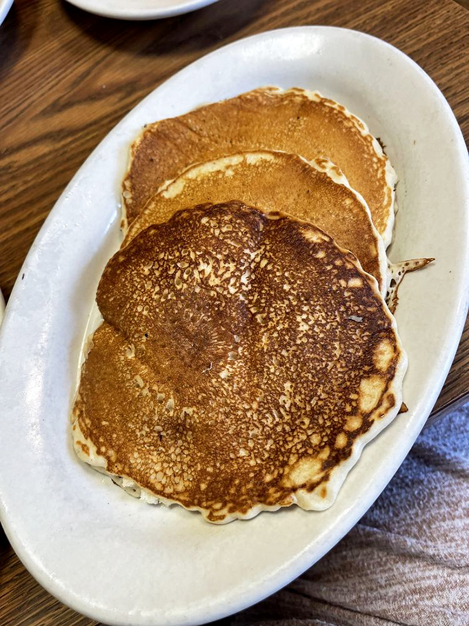 These pancakes have achieved that elusive golden-brown perfection that home cooks dream about. Flat may be their shape, but flat is never their flavor.