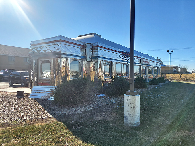 Penny's Diner gleams like a chrome time capsule under the Kansas sun. This classic roadside stop promises the kind of breakfast that fuels adventures.