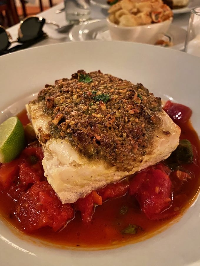Pistachio-encrusted halibut swimming in a tomato sea. A dish that makes you wonder why you ever eat anything else.