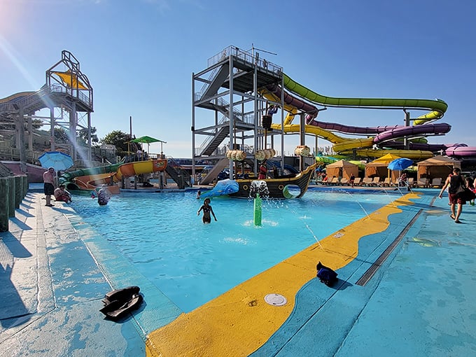 The shallow play area offers pint-sized adventurers their own aquatic kingdom, where even the smallest splashers become water park royalty.