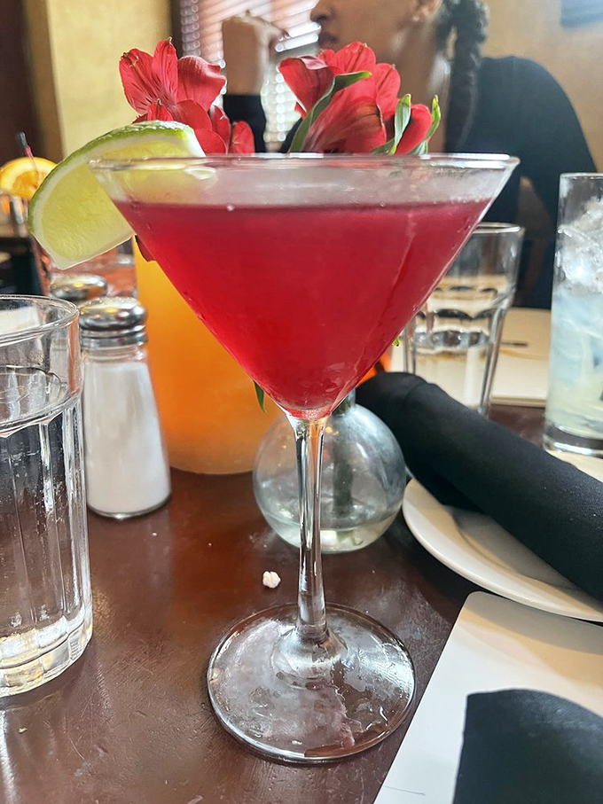 Ruby-red liquid art with a lime accent&mdash;this cocktail isn't just a drink, it's the opening act to your carnivorous symphony. Cheers to decisions well made.