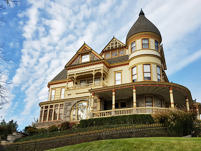 The Queen Anne Mansion stands like a wedding cake come to life, its Victorian splendor a testament to Eureka Springs' golden age of architecture.