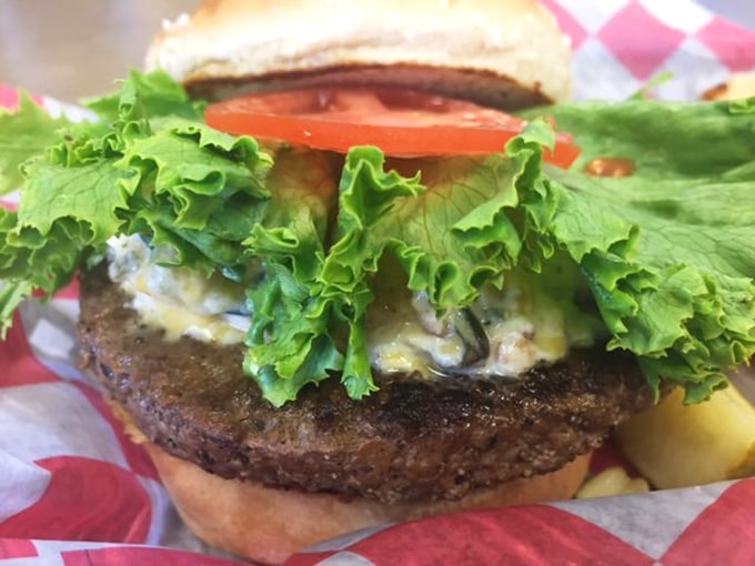 A burger that doesn't need fancy tricks – just honest beef, melty cheese, and fresh veggies. The kind that requires the "lean forward" eating stance.