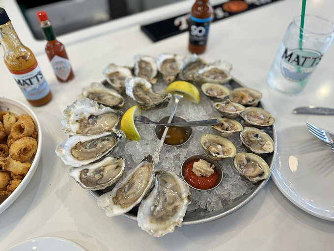 Oyster nirvana on ice. This glistening platter of briny treasures is the ocean's finest gift, requiring nothing more than a squeeze of lemon and appreciative silence.