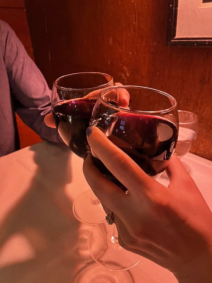 Wine glasses clinking in the low light &ndash; where many great ideas, first dates, and celebration toasts have been born over decades.