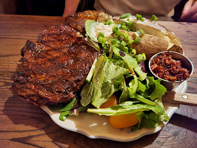 The kind of ribeye that makes conversation stop mid-sentence, paired with greens that somehow don't feel like punishment.