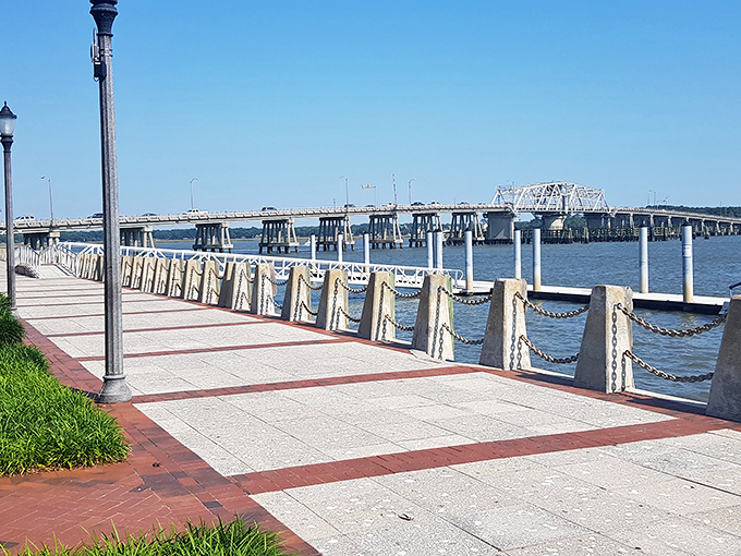 The riverwalk offers that rare combination &ndash; architectural elegance meeting natural beauty, with a bridge that seems to stretch toward possibility.