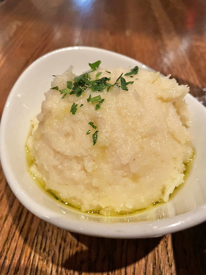 Mashed potatoes that make you question every other potato you've ever eaten. Creamy, garlicky clouds that refuse to be mere sidekicks.