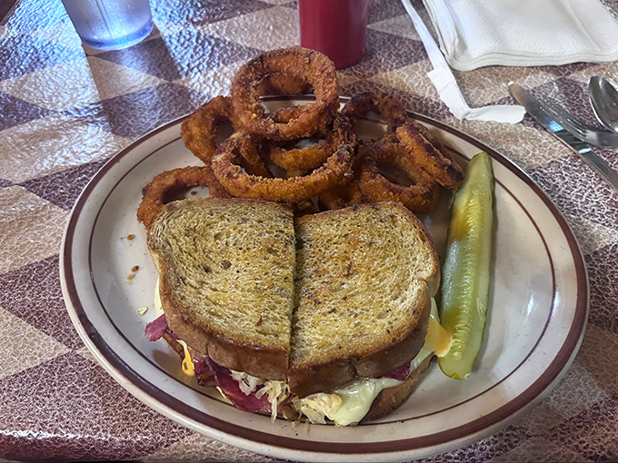 The Reuben sandwich and onion rings combo&mdash;where crispy, crunchy, and savory meet in perfect harmony. Diet plans come here to die.