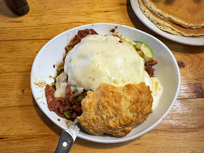 Biscuit heaven with a side of savory goodness. That gravy isn't just poured&mdash;it's lovingly blanketed over everything.