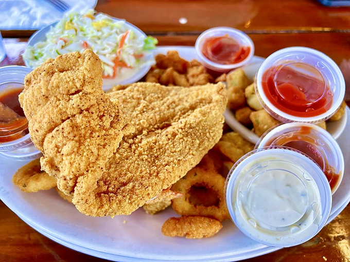 The indecisive diner's dream plate. Golden-fried seafood perfection with all the fixings&mdash;no passport to the coast required.