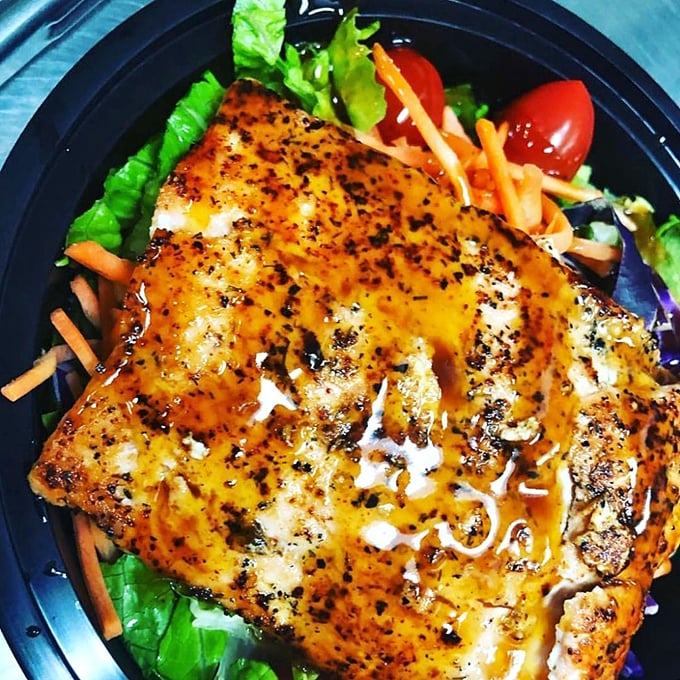 Proof that Off The Hook isn't just about frying&mdash;this grilled salmon salad brings the healthy option without sacrificing an ounce of flavor.