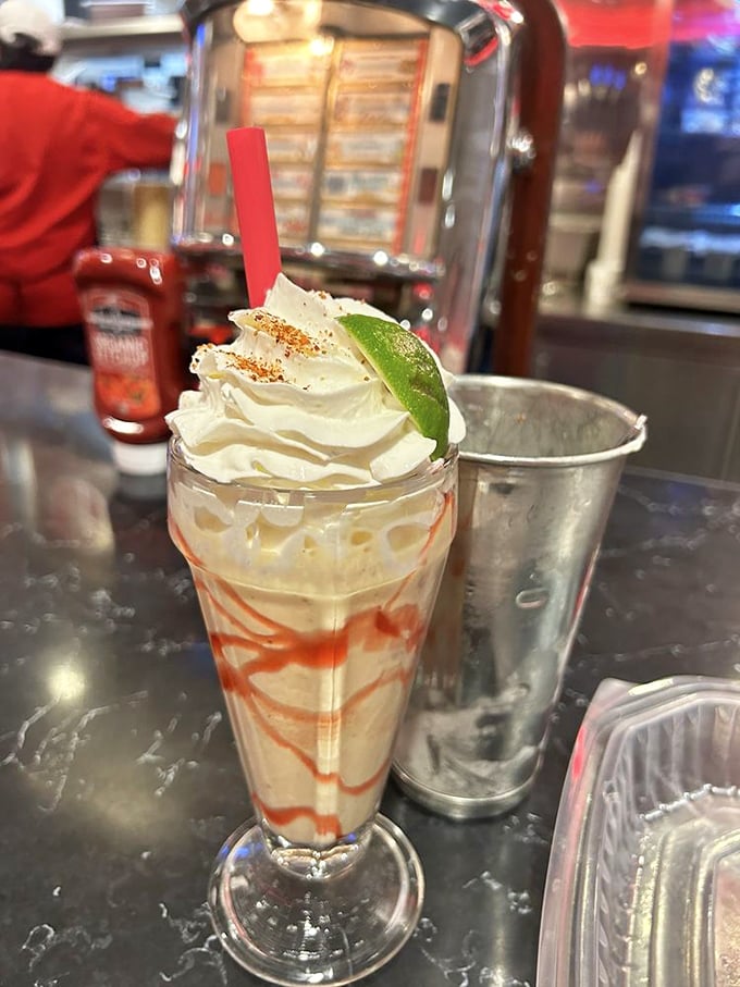 This isn't just a milkshake—it's summer in a glass. The mango shake with its caramel swirl and whipped cream crown deserves its own Instagram account.