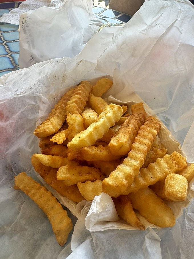 These aren't just fries; they're strategic heat management tools. Crispy, golden lifeboats in a sea of delicious fire.