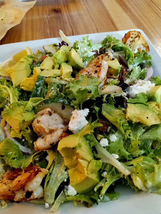 A salad so beautiful it belongs in the Louvre. Fresh greens, grilled shrimp, and avocado create the kind of healthy option you actually want to eat.