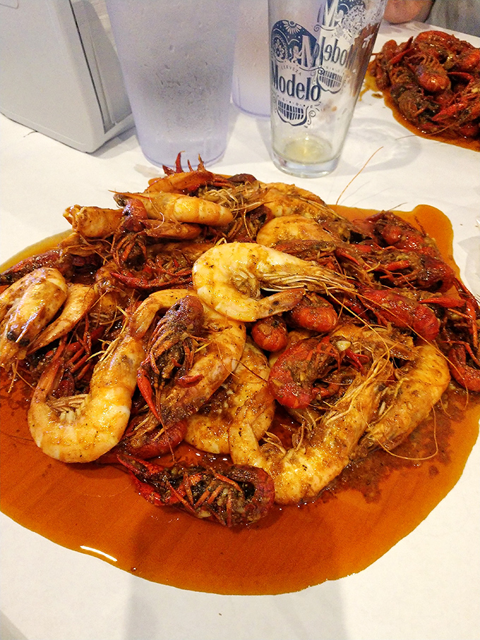 A culinary mosh pit where shrimp and crawfish crowd-surf in a sea of savory sauce. Rock on, little crustaceans, rock on.