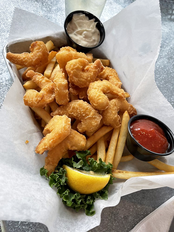 Golden-fried shrimp nestled among crispy fries&mdash;a basket of seaside comfort that tastes like summer vacation, regardless of the season.