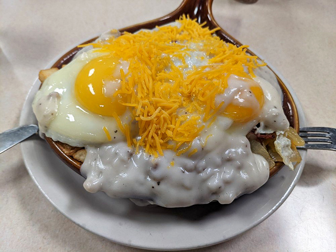 Eggs, cheese, and sausage gravy unite in this skillet masterpiece&mdash;breakfast's answer to the question, "Why get out of bed today?"