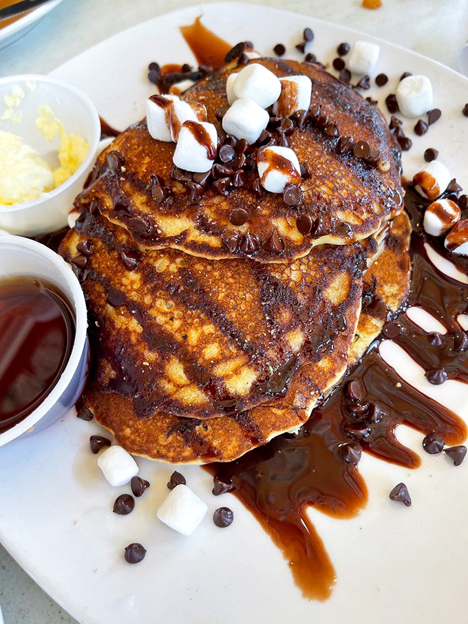 These pancakes don't just look like dessert&mdash;they've fully embraced their sweet destiny with marshmallows, chocolate, and caramel in a breakfast disguise.