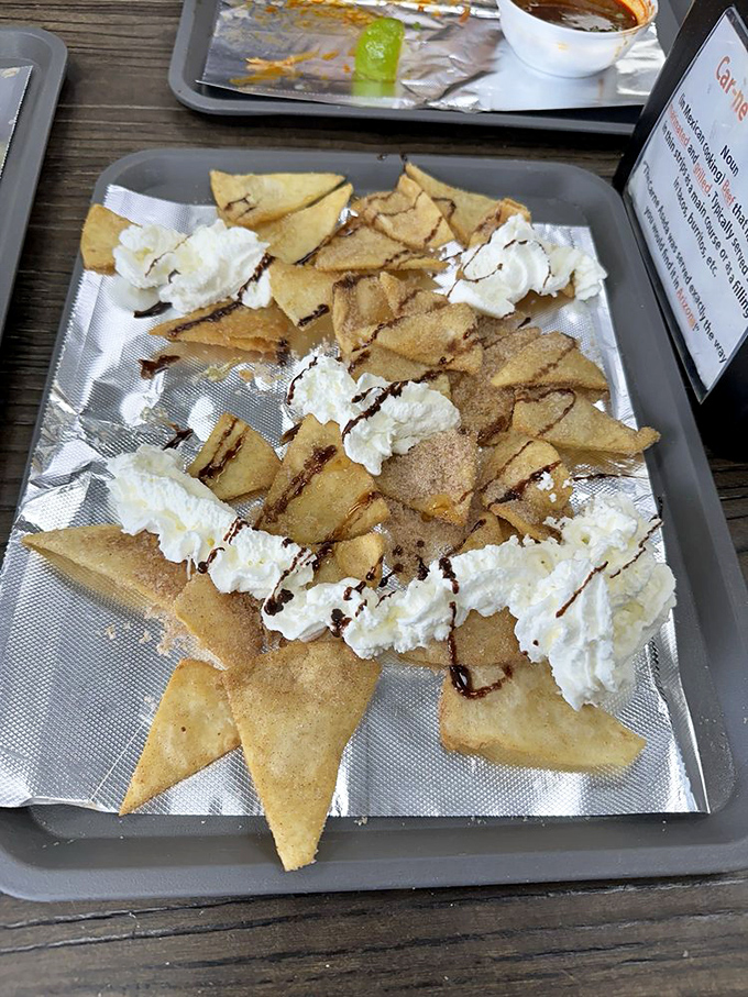 These sopapillas with whipped cream and chocolate drizzle aren't just dessert&mdash;they're the finale to a symphony of flavors that deserves a standing ovation.