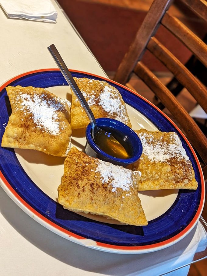 Golden sopapillas dusted with cinnamon sugar, ready for their honey bath&mdash;pillows of fried dough that make donuts seem downright boring.