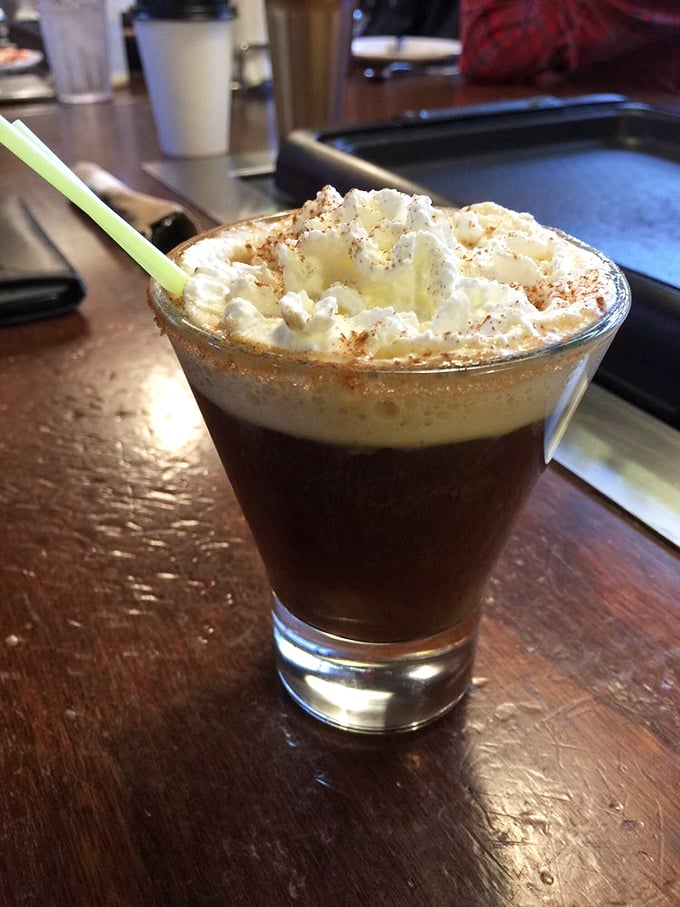 The Spanish coffee isn't just a drink—it's dessert in disguise, wearing a whipped cream hat and cinnamon cologne.