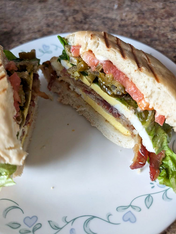 Melty cheese cascading over fresh ingredients&mdash;this sandwich doesn't just satisfy hunger, it creates a moment of pure, messy joy.