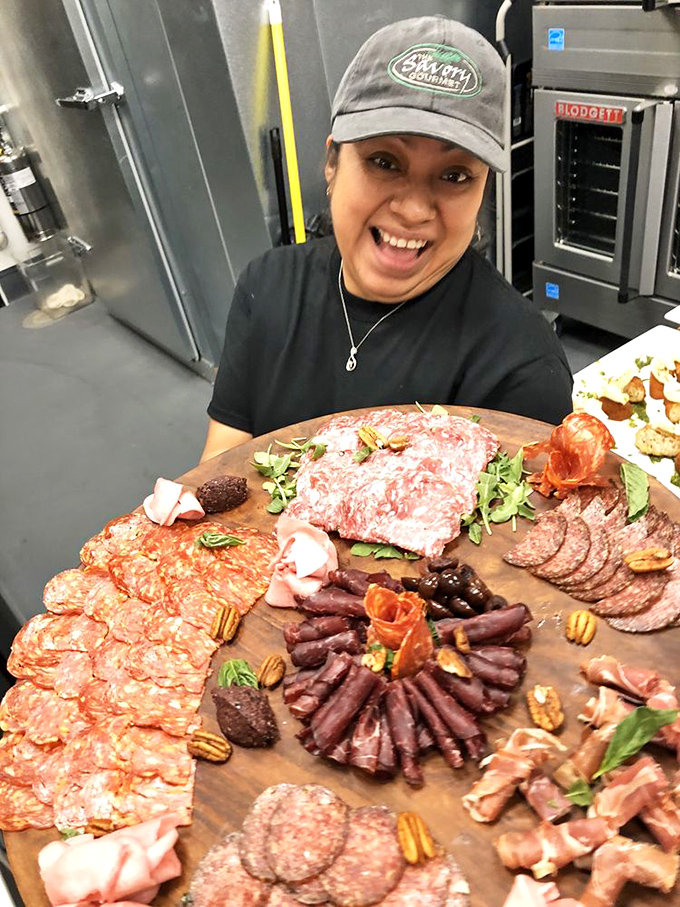 Behind every great charcuterie board is someone who knows their salami from their sopressata. That smile says "I'm about to make your day."