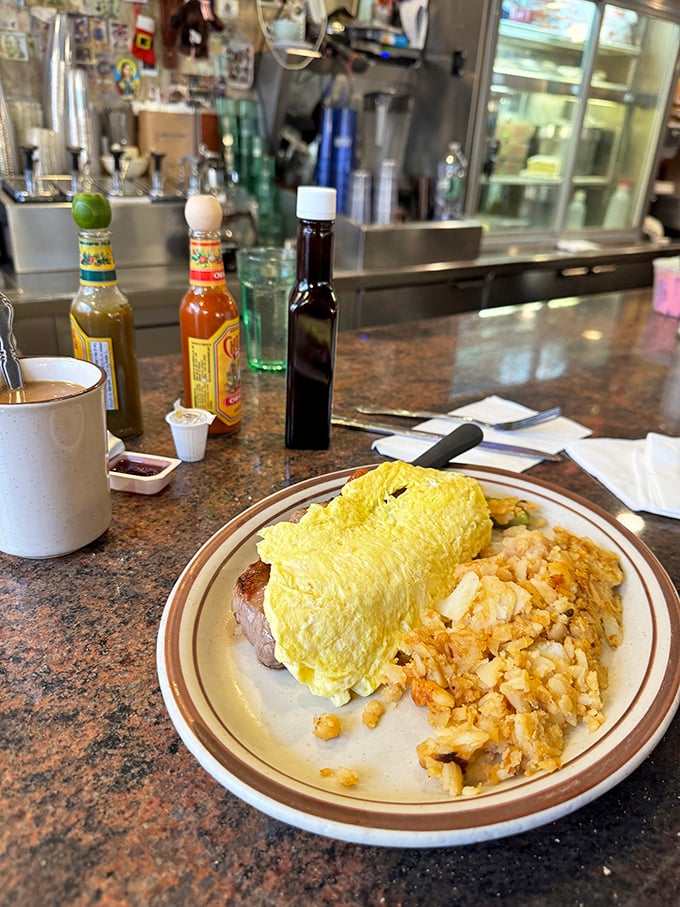 Counter dining perfection: a hearty plate of steak and eggs with those legendary home fries that somehow improve with every bite.