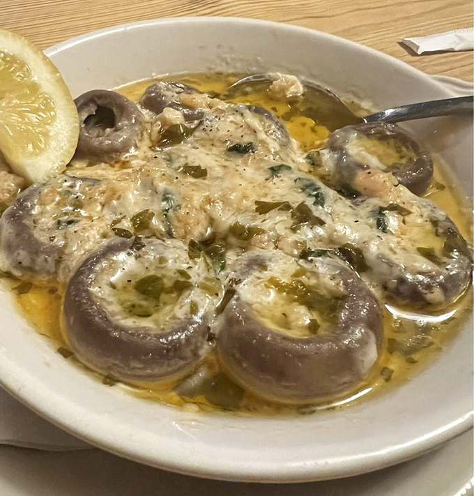 These aren't just stuffed mushrooms; they're little boats sailing on a buttery sea. Whoever invented this deserves a Nobel Prize in Deliciousness.