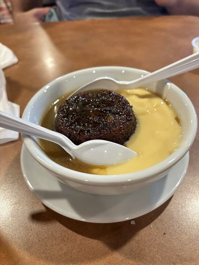Sticky toffee pudding swimming in custard&mdash;proof that the British actually do know a thing or two about dessert.
