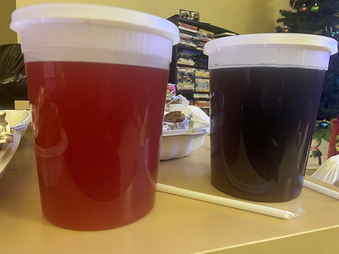 Sweet tea and what looks like church punch&mdash;liquid Southern hospitality in plastic cups. The perfect companions to cut through rich, savory flavors.
