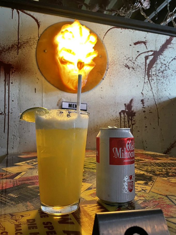 Nothing says "refined dining" quite like sipping a cocktail beneath a glowing demon skull.