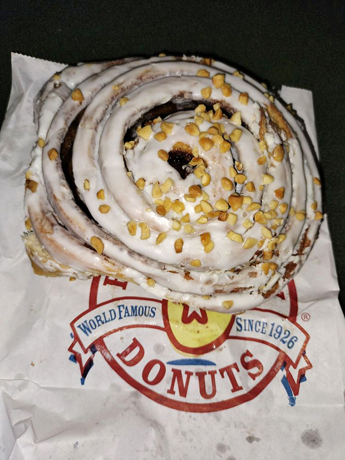 This cinnamon roll with its crown of chopped pecans isn't just breakfast&mdash;it's edible Texas heritage on parchment paper.