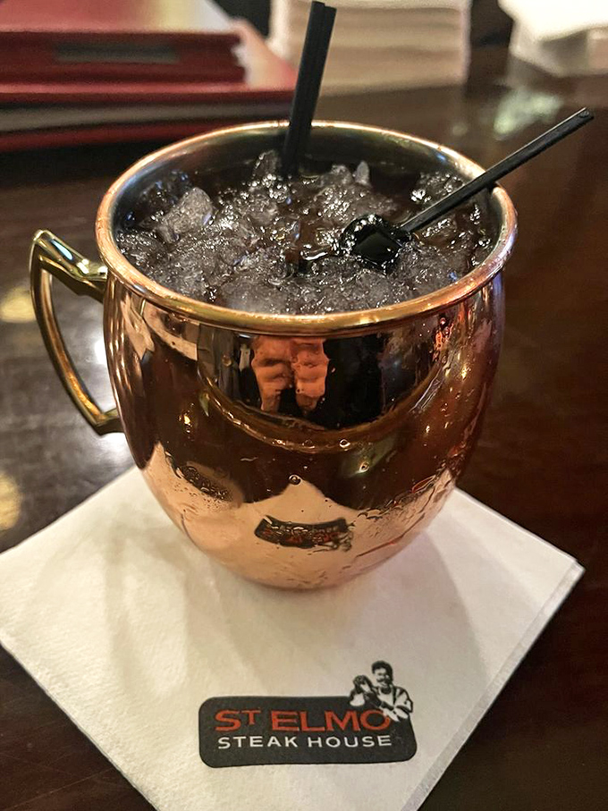 The Moscow Mule gets the St. Elmo treatment in this gleaming copper mug. It's not just a drink; it's a shiny, refreshing accessory.